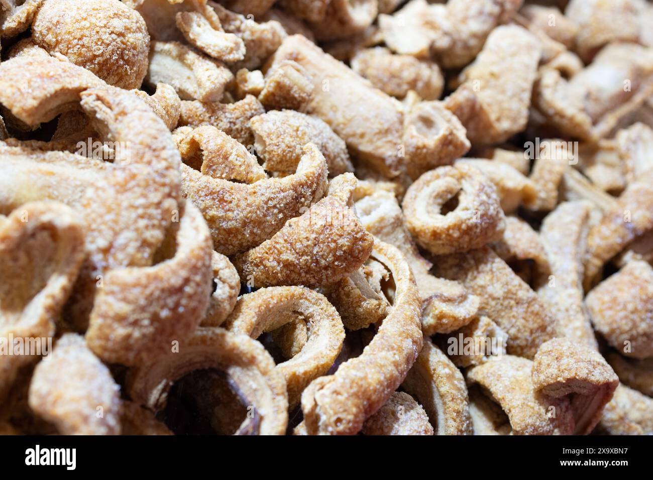 Pork rinds or deep fried pork skin background. Full frame Stock Photo ...