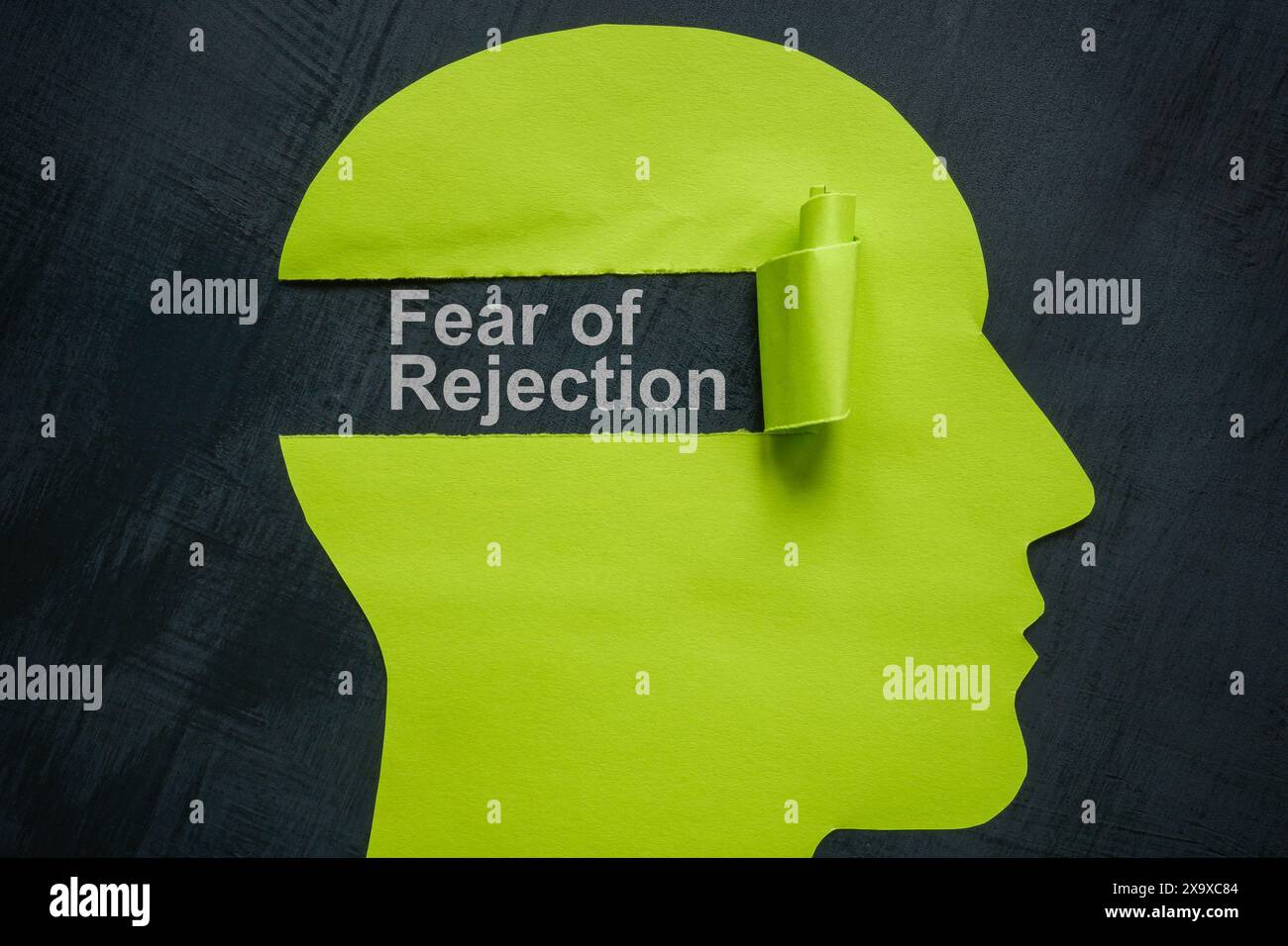 Fear of rejection concept. Paper head and torn off piece Stock Photo ...