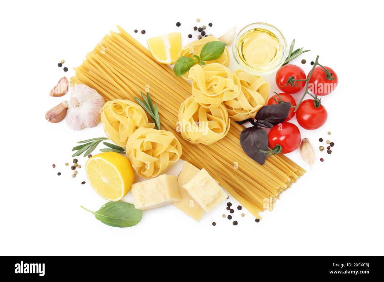 Different types of pasta and ingredients on white background, top view ...