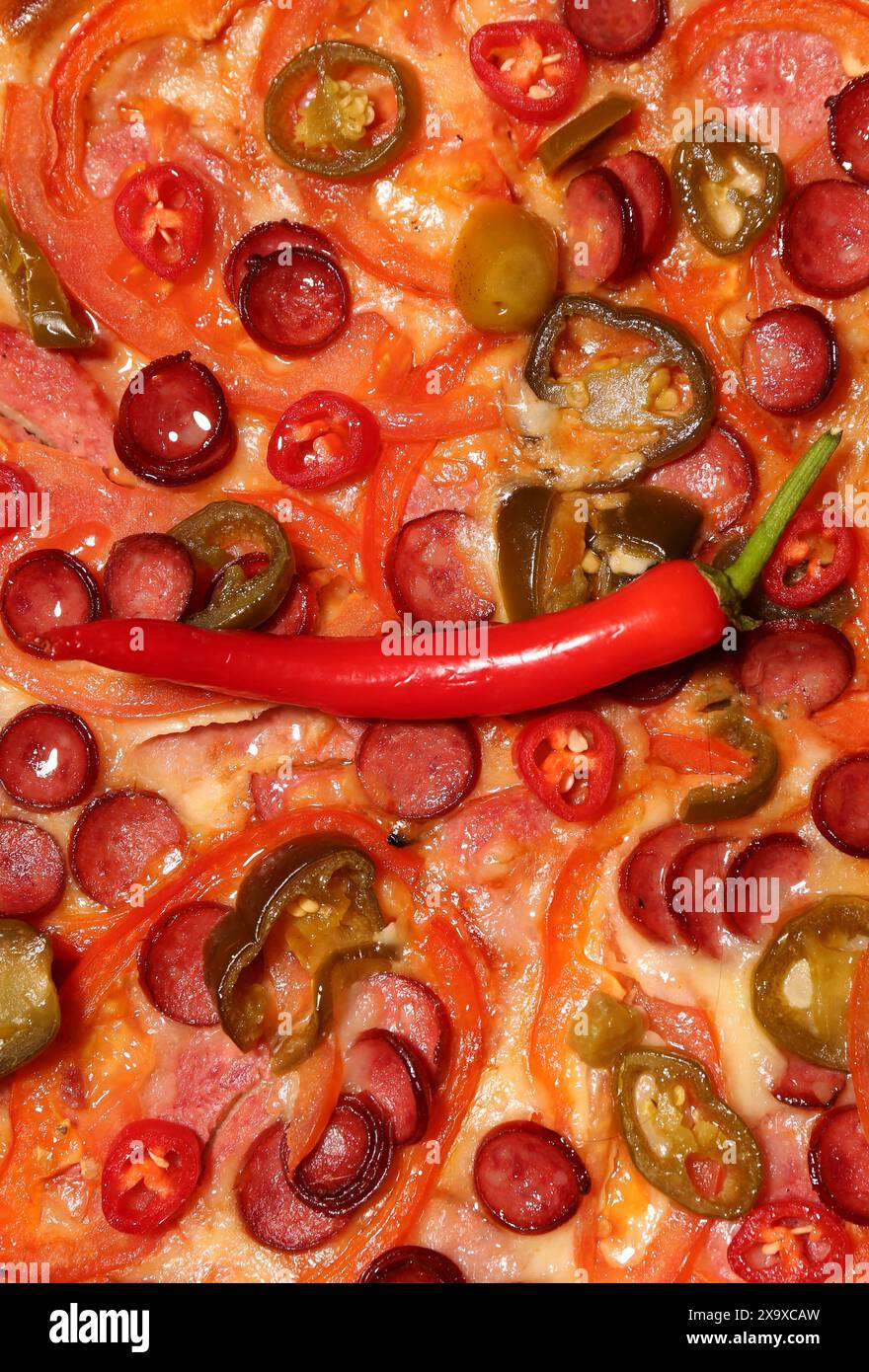Delicious pizza Diablo with chili pepper as background, top view Stock ...
