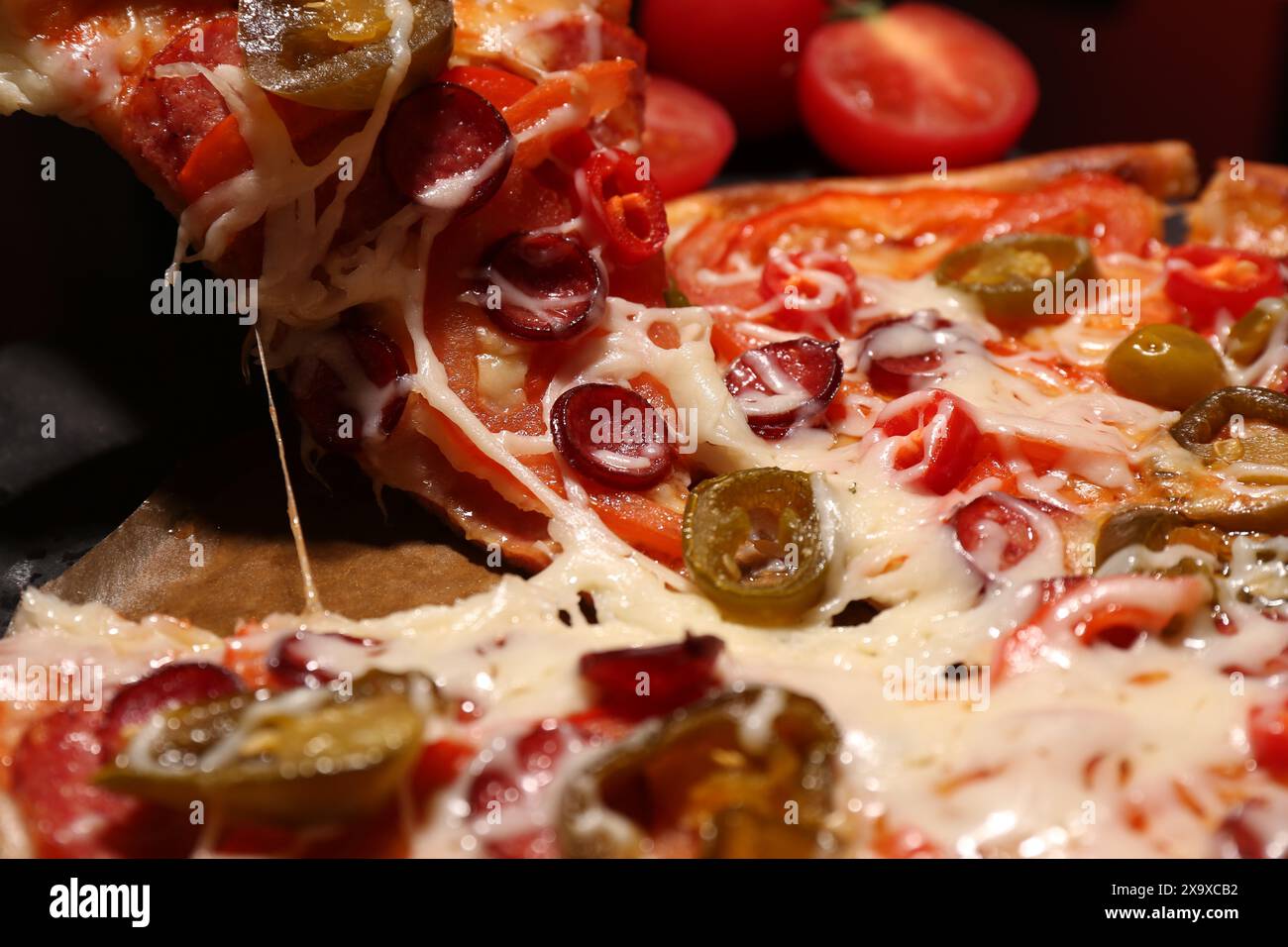 Taking piece of delicious pizza Diablo, closeup Stock Photo - Alamy