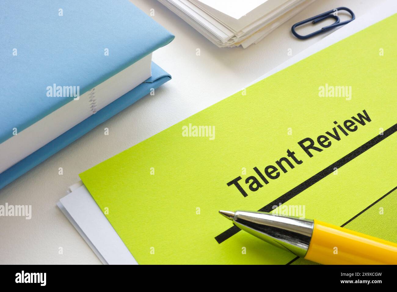 Talent review form and a pen Stock Photo - Alamy