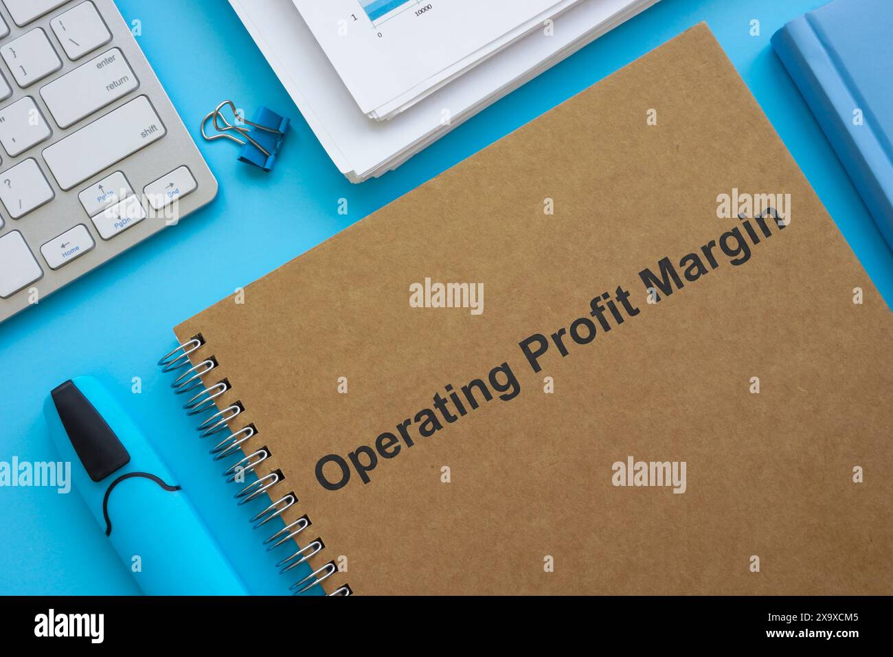 Operating profit margin documents, papers and marker Stock Photo - Alamy