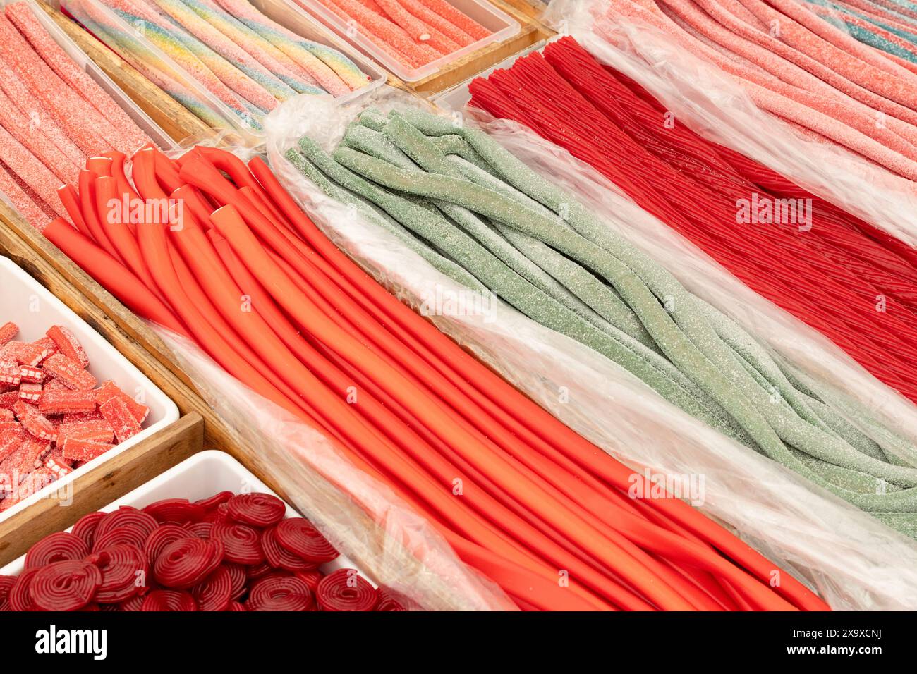 Colorful assorted licorice candies on trays for sale on marketplace ...