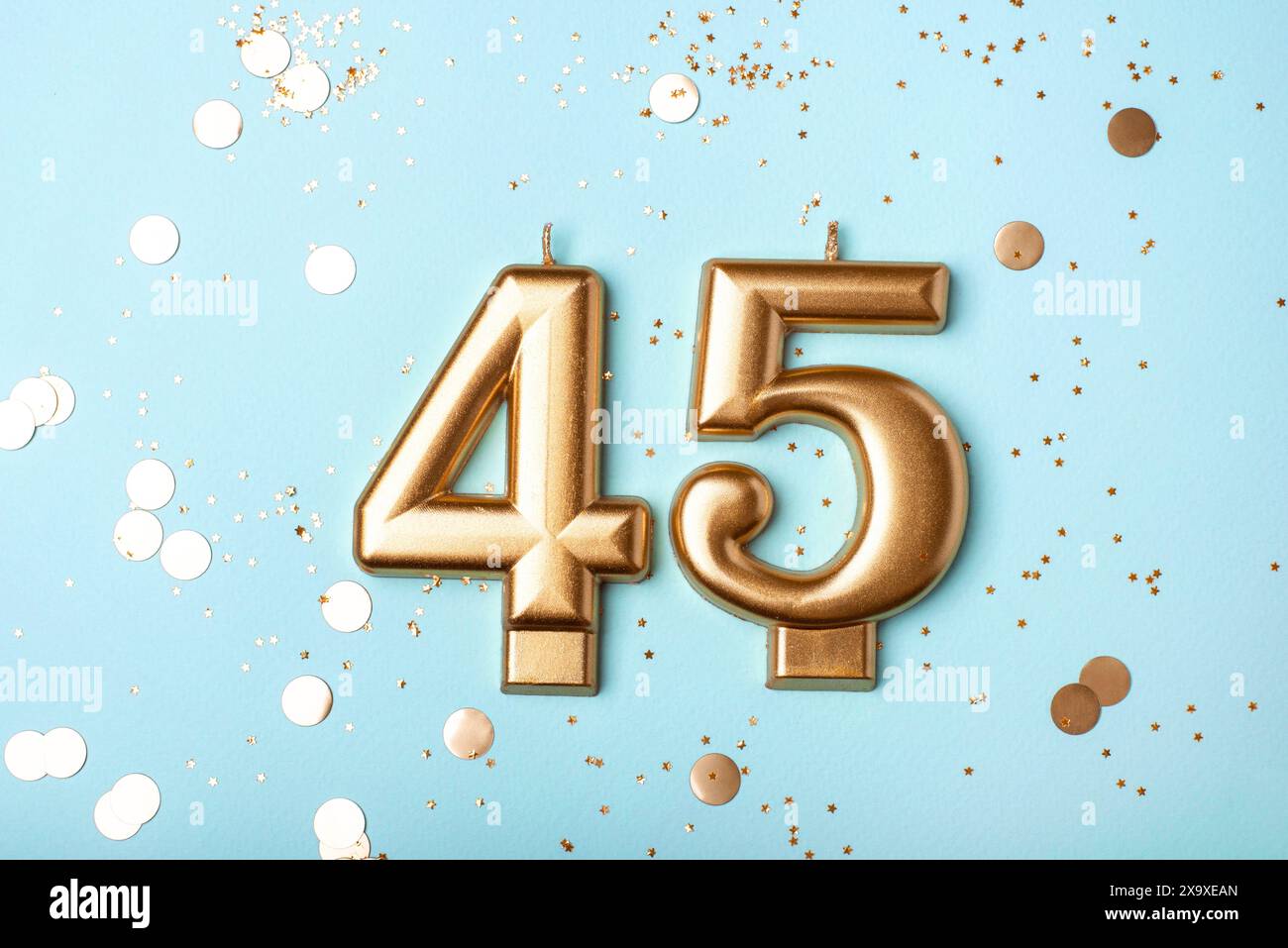 45 years celebration. Greeting banner. Gold candles in the form of ...