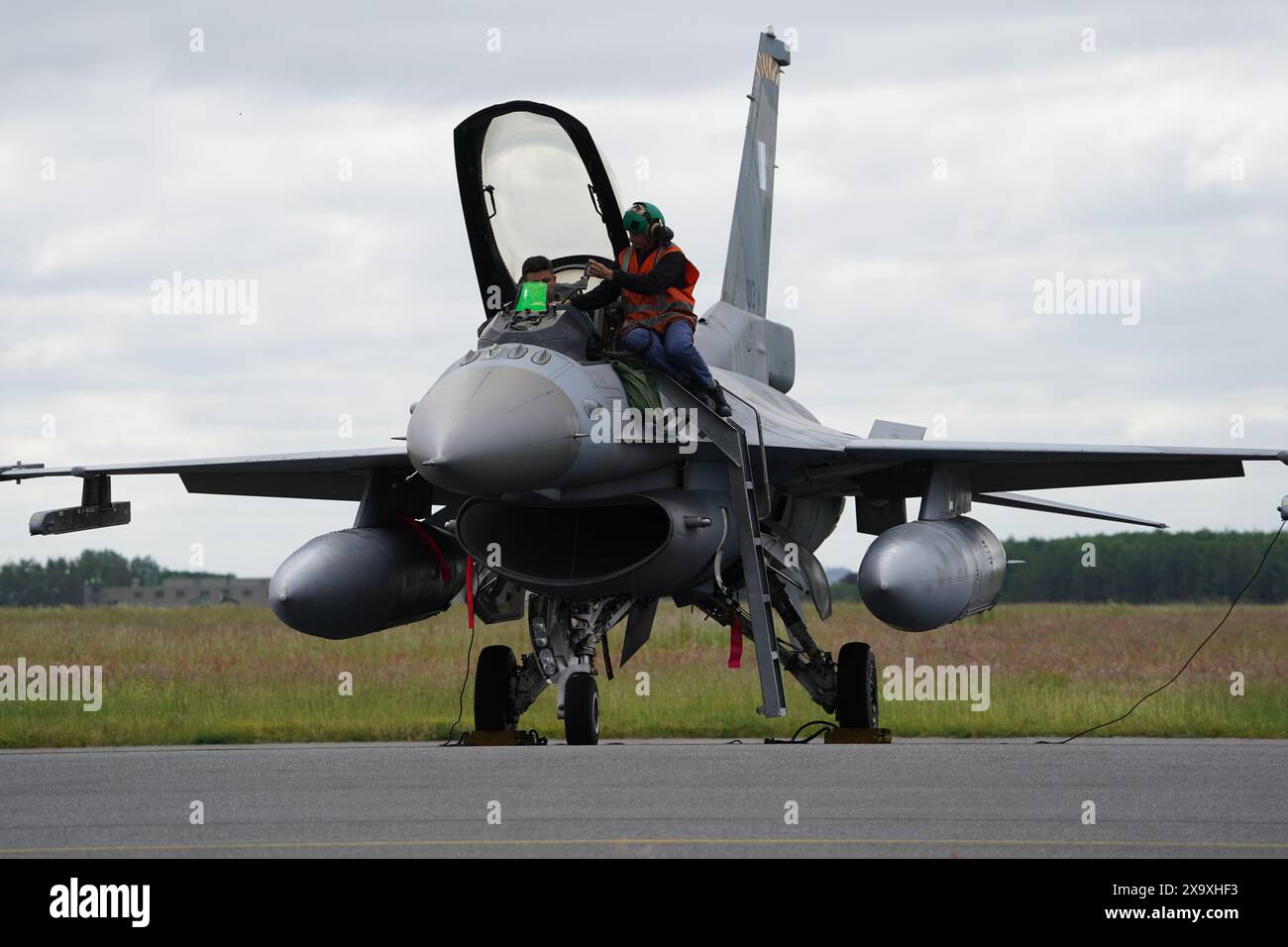 Jagel, Germany. 03rd June, 2024. A pilot and a technician prepare to ...