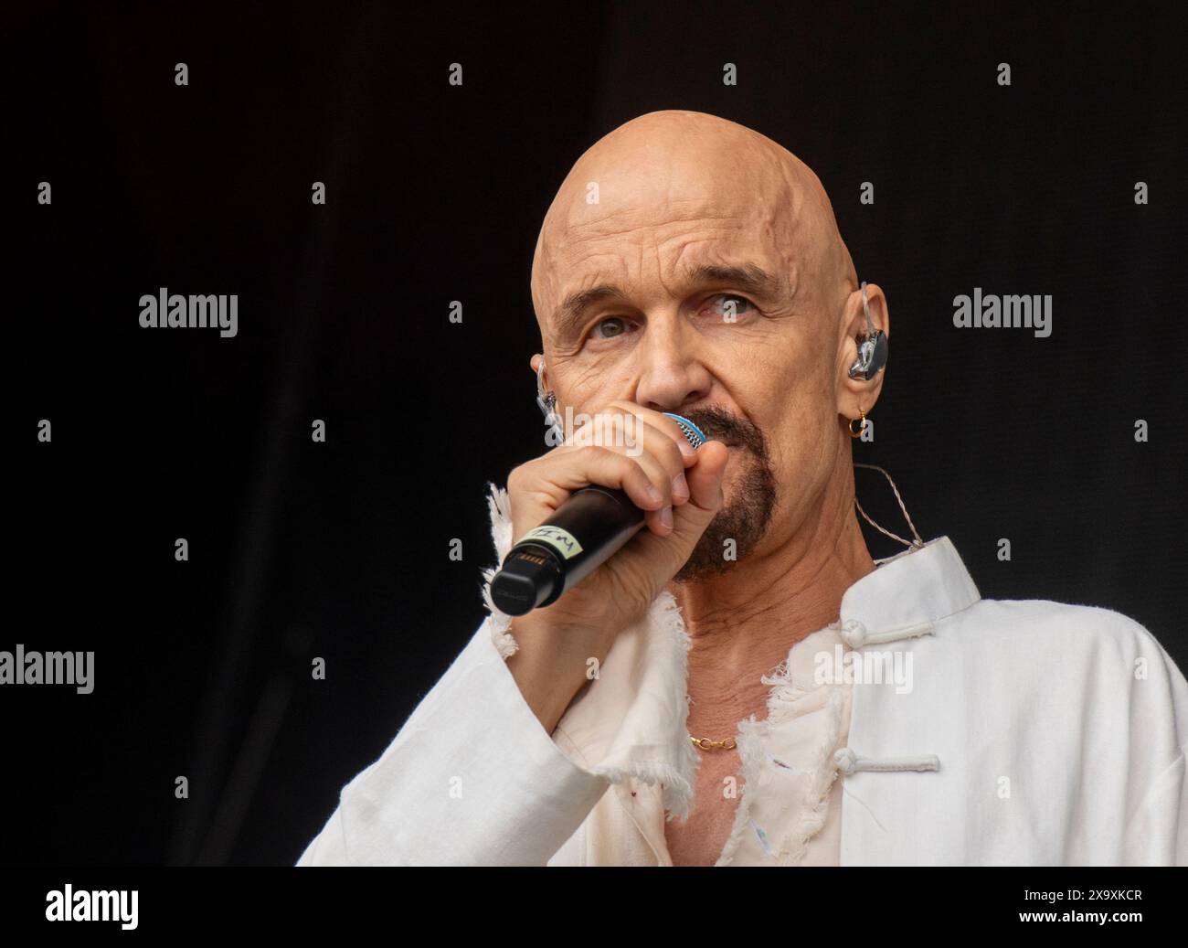 Tim Booth and his band James playing an orchestral and choral set live ...