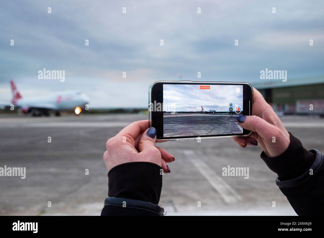 Seen on the screen of a spectators smartphone the Virgin Orbit plane ...