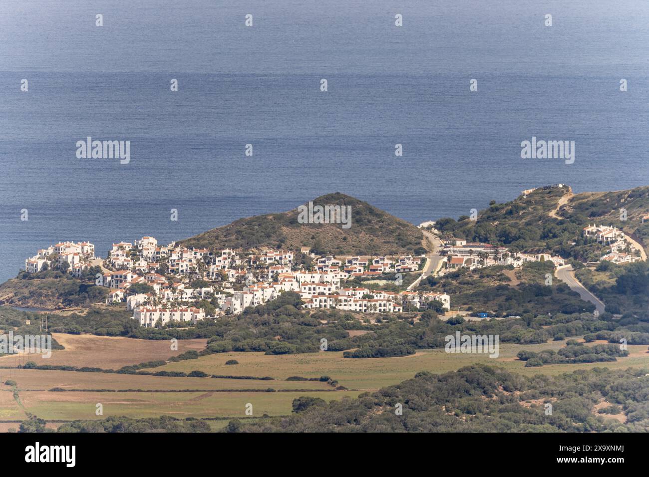 Nestled between lush green hills hi-res stock photography and images ...