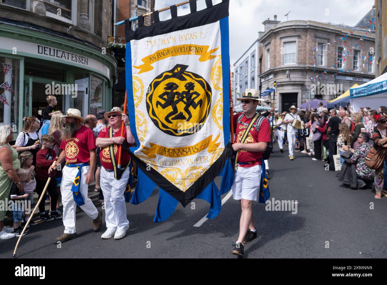 The banner for the Golowan Festival leading the colourful Mazey Day ...