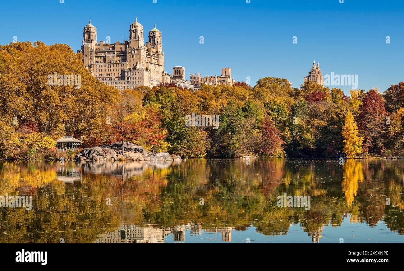 Scenic autumn view of the Central Park lake with colorful fall foliage ...