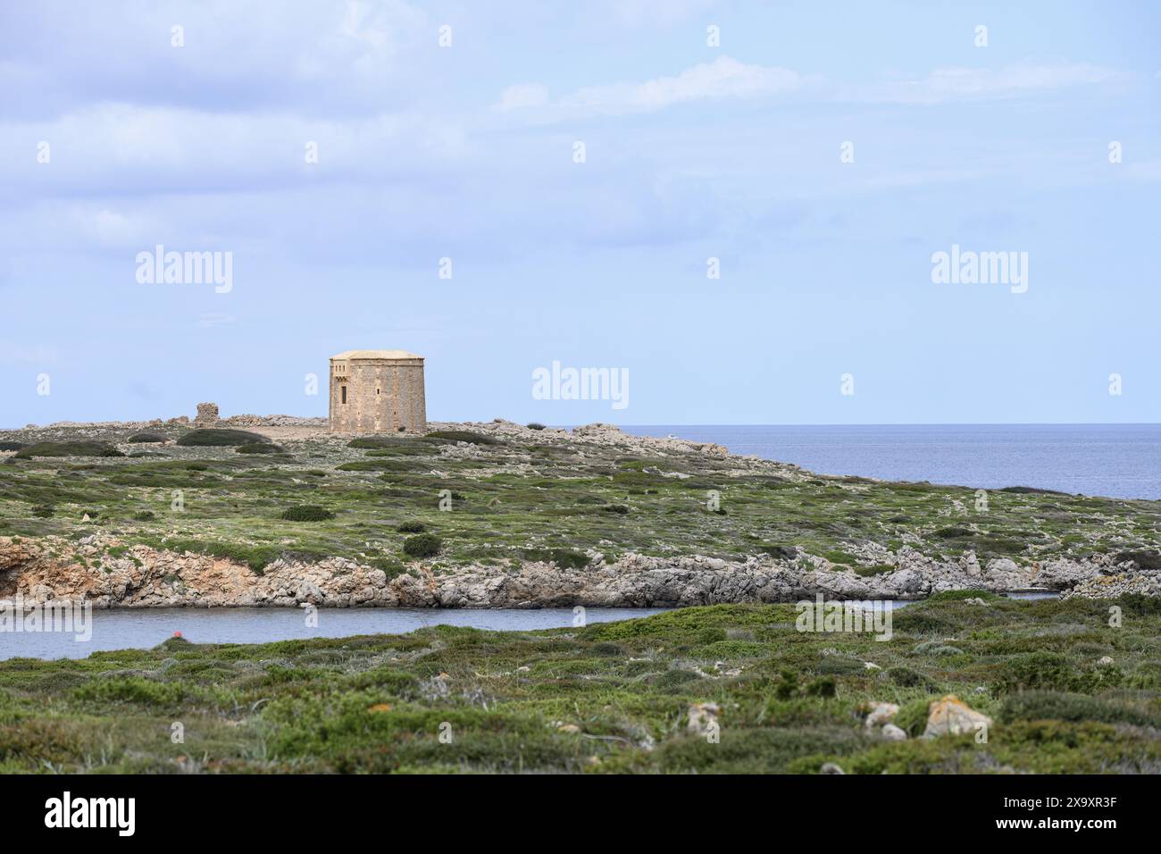 The historic Torre de Sanitja stands on a rugged rocky promontory ...