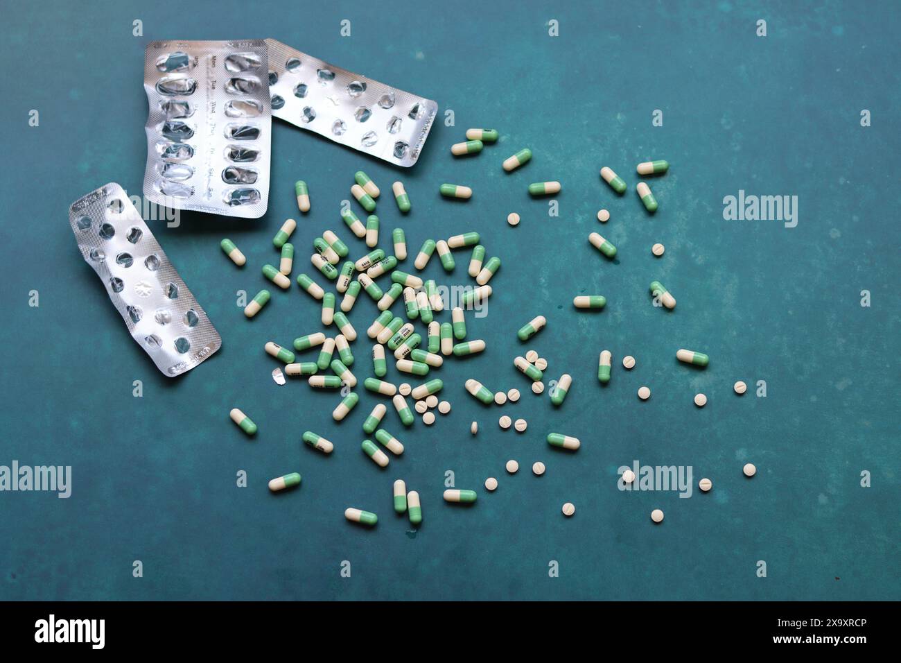 Conceptual still life with pharmaceutical pills and capsules against ...