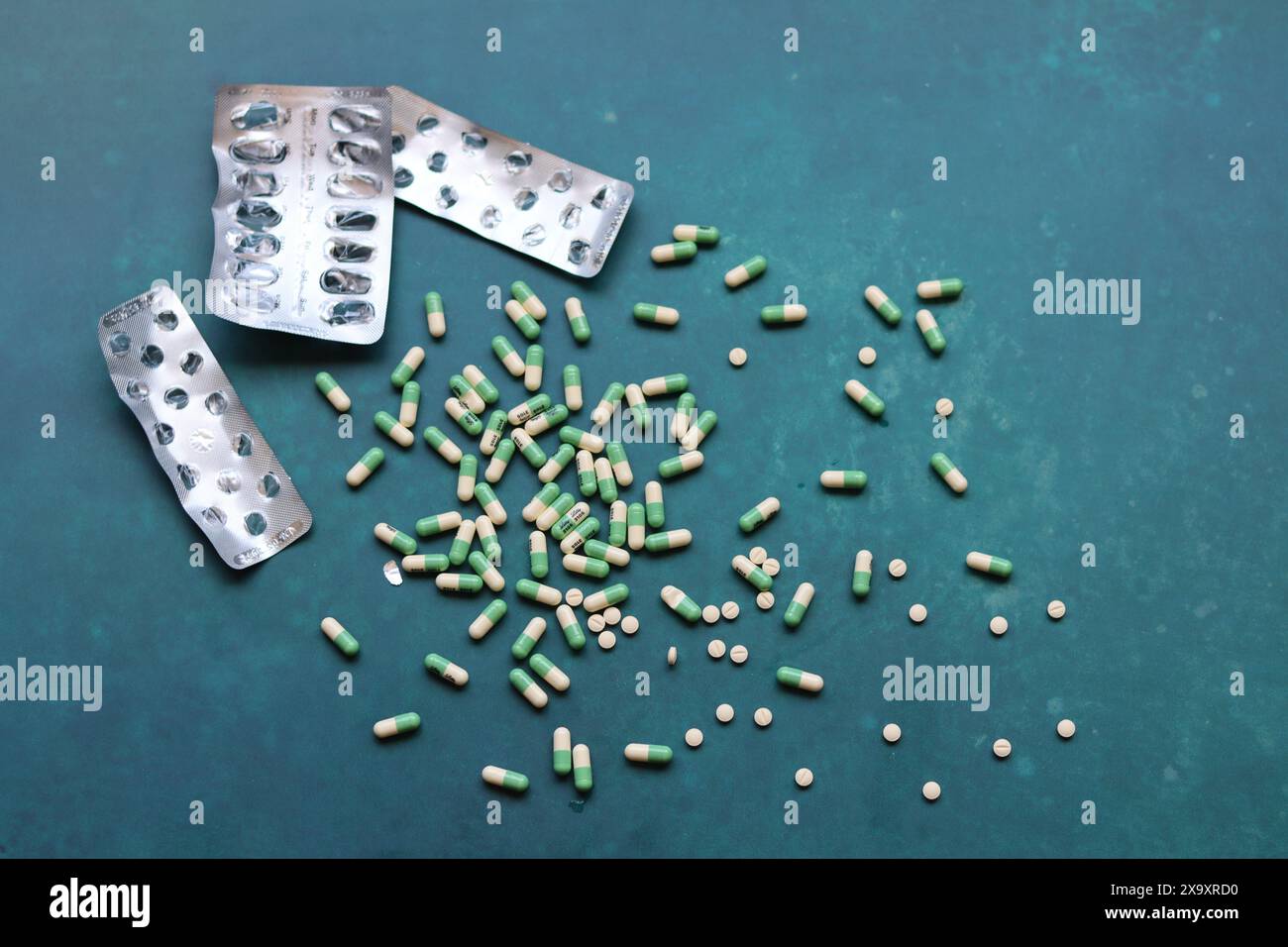 Conceptual still life with pharmaceutical pills and capsules against ...