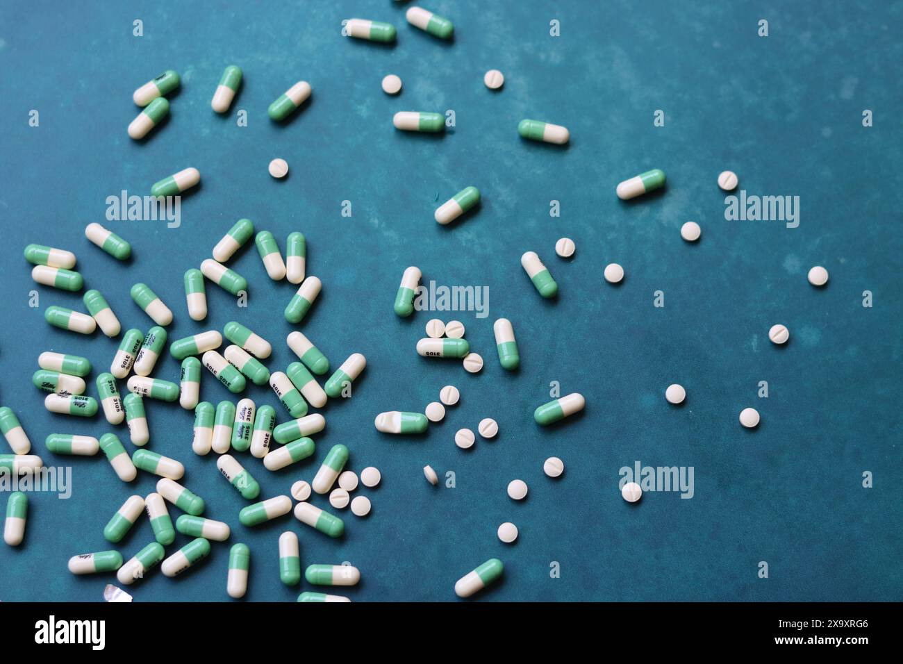 Conceptual still life with pharmaceutical pills and capsules against ...