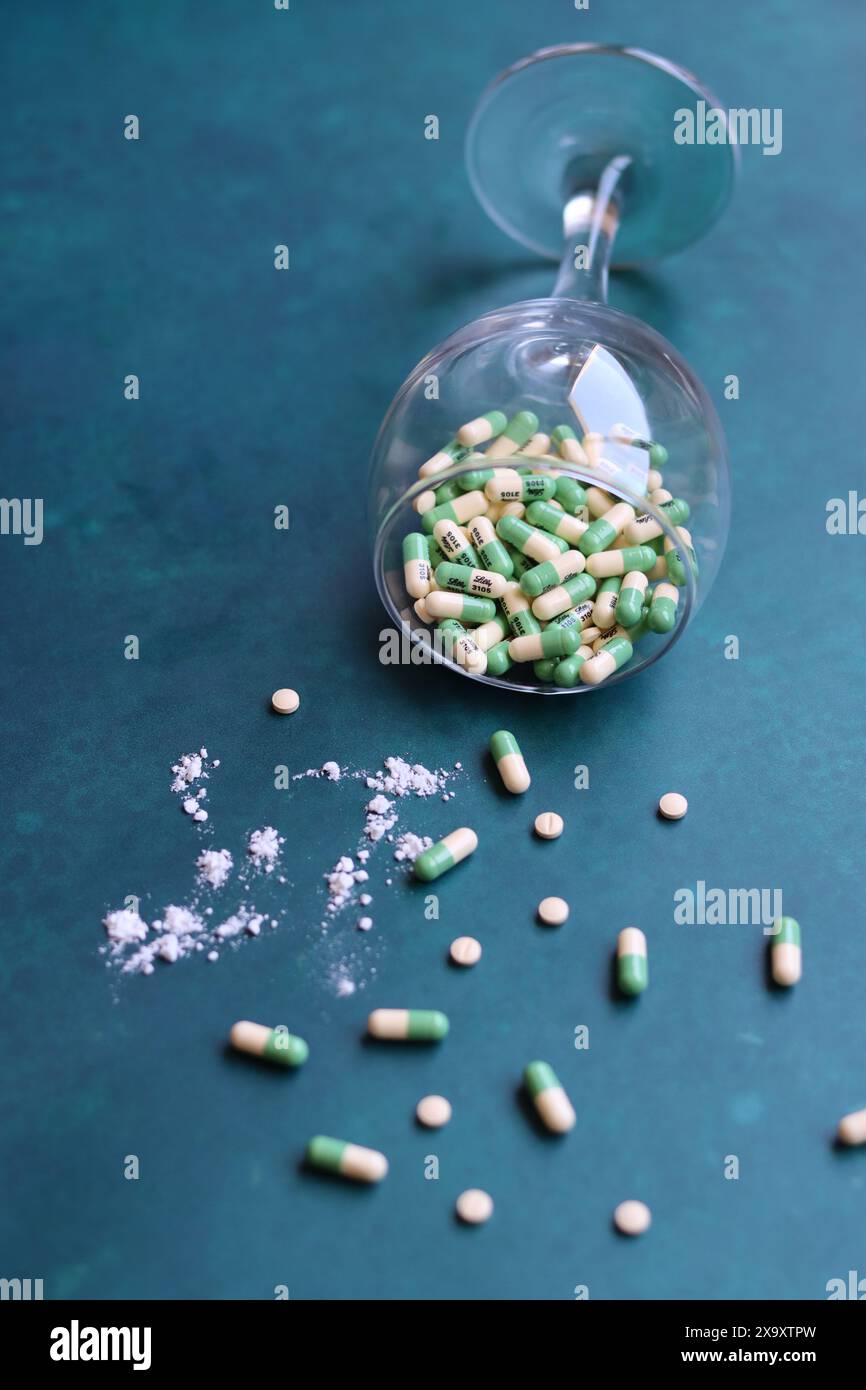 Conceptual still life with pharmaceutical pills and capsules against ...