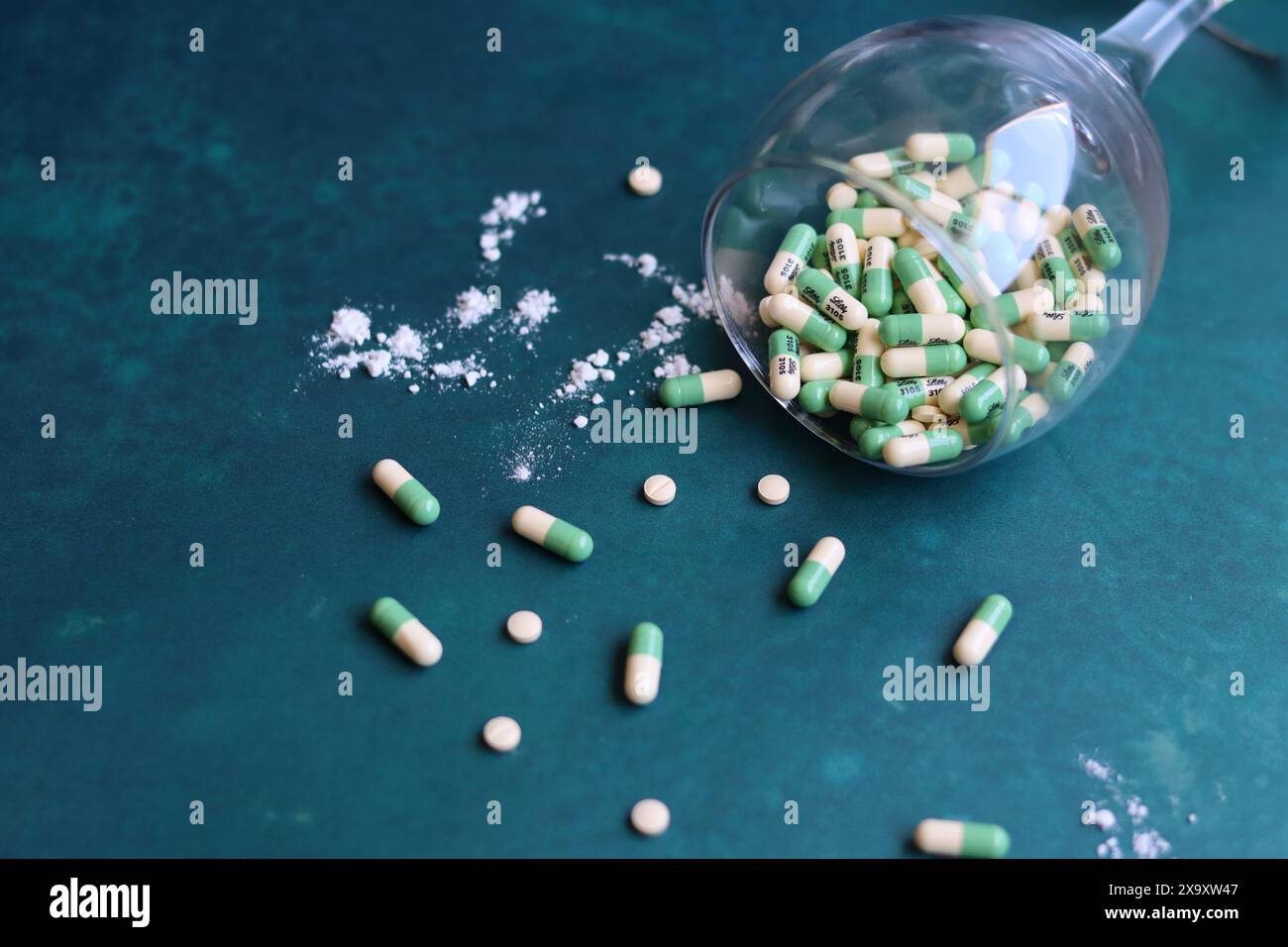 Conceptual still life with pharmaceutical pills and capsules against ...