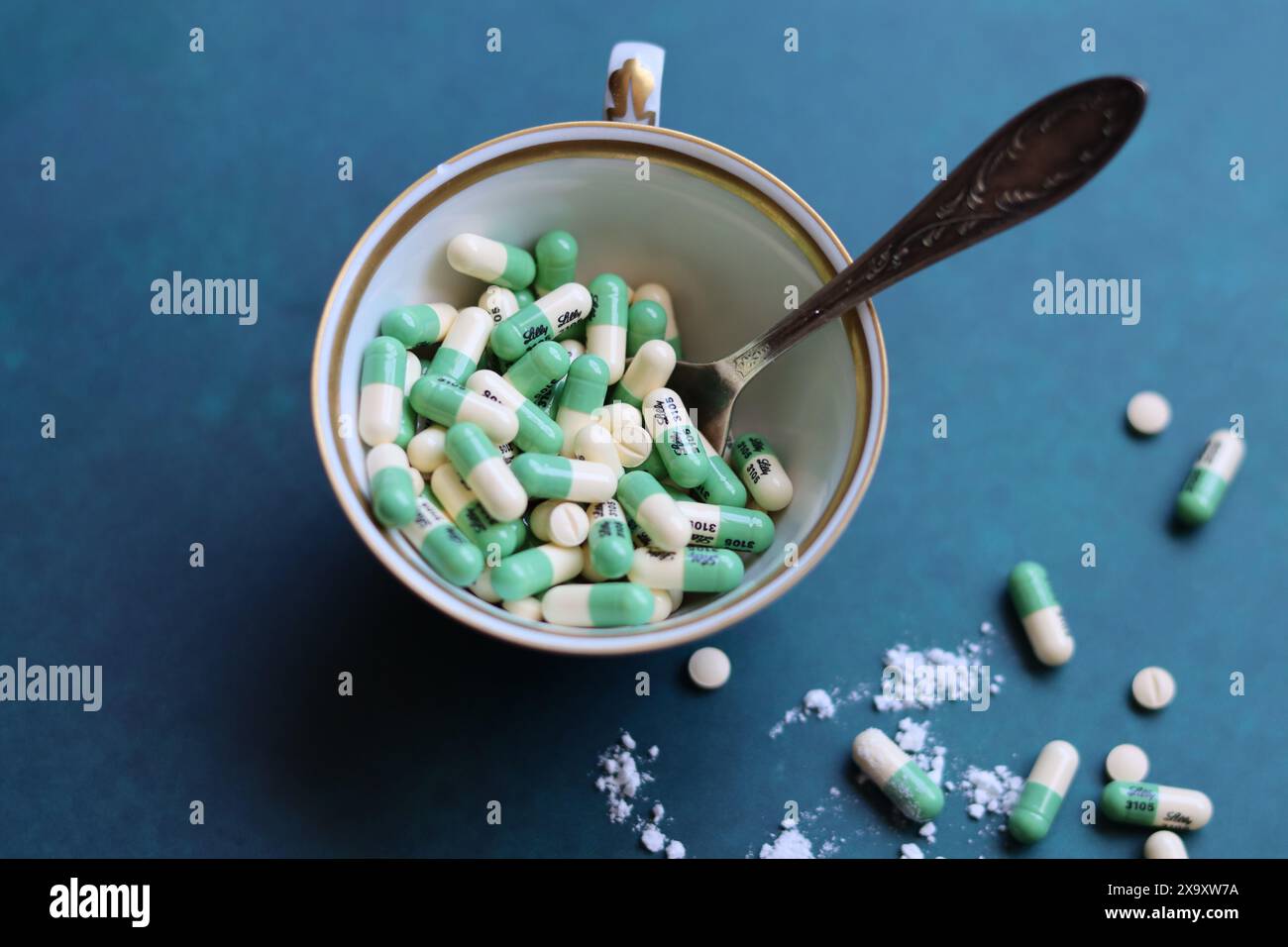 Conceptual still life with pharmaceutical pills and capsules against ...