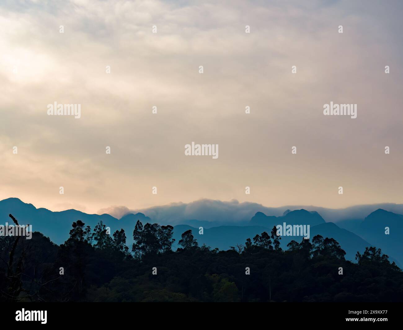 Soft clouds formations float over the Iguaque mountain, in the eastern ...
