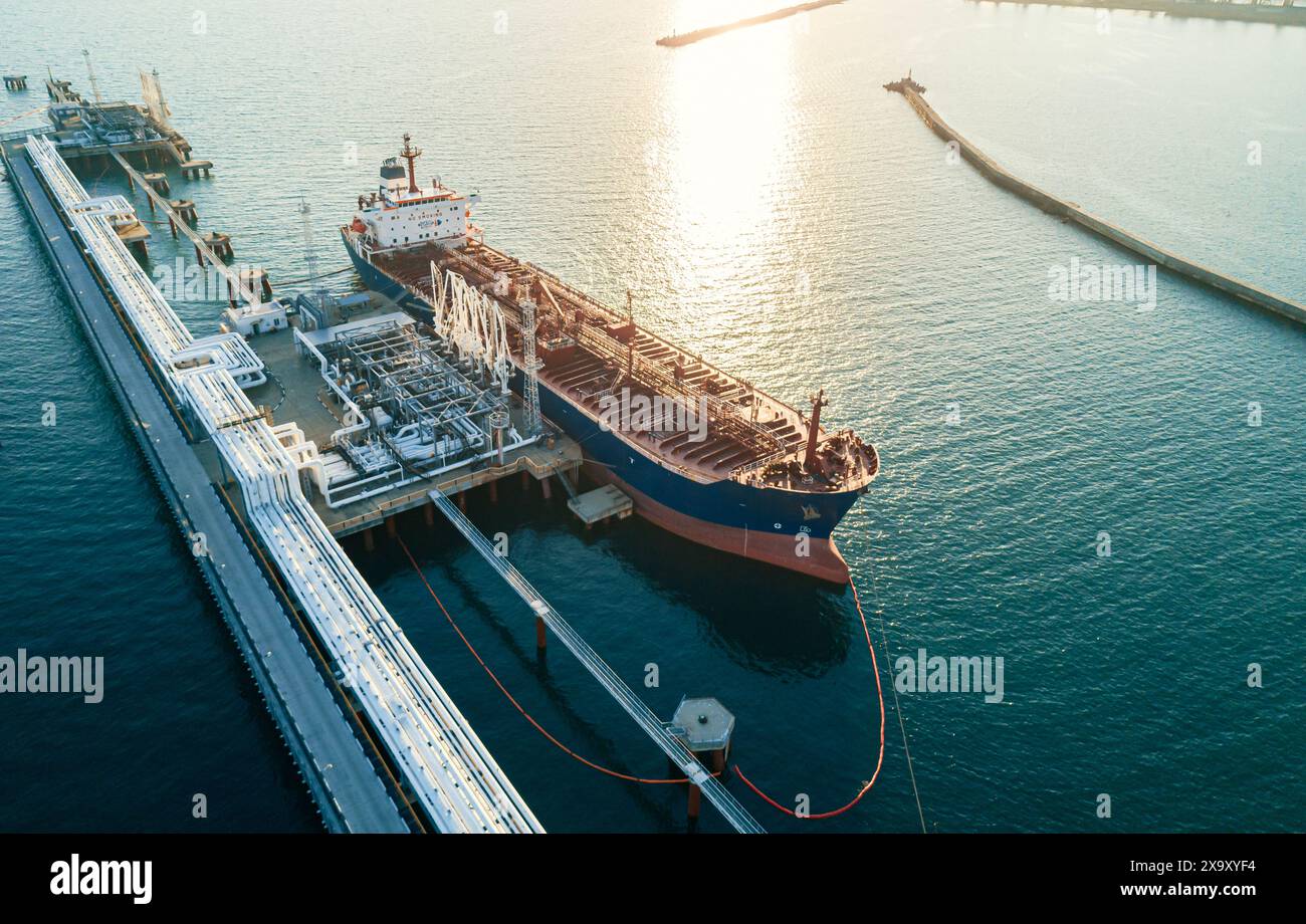 Aerial view of a large oil tanker docked at a pier in the port in ...