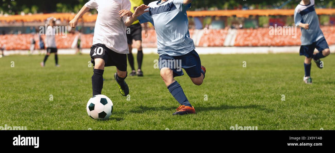 Two Kids Playing Football Ball on Grass Field. Happy School Boys ...