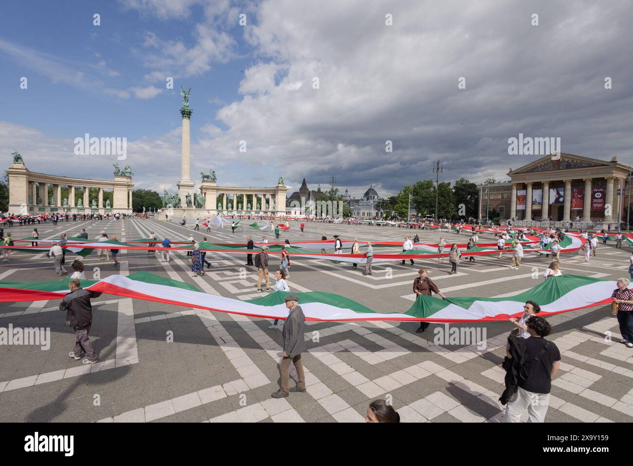 Budapest, Hungary. 2nd June, 2024. People march with a 1,848-meter-long Hungarian flag to ...