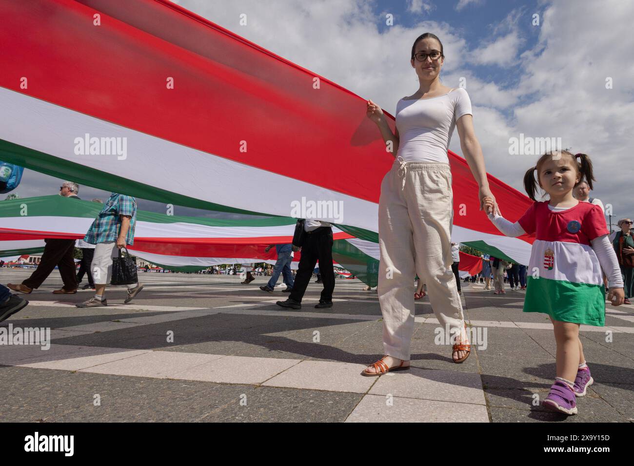 Budapest, Hungary. 2nd June, 2024. People march with a 1,848-meter-long Hungarian flag to ...