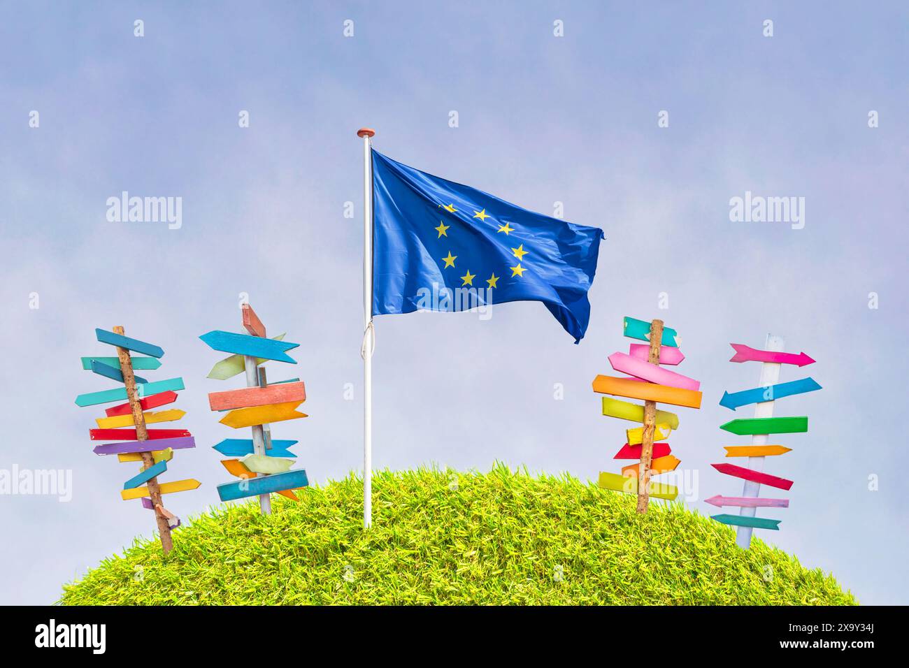 Official EU flag on grass with empty wooden direction signs Stock Photo ...