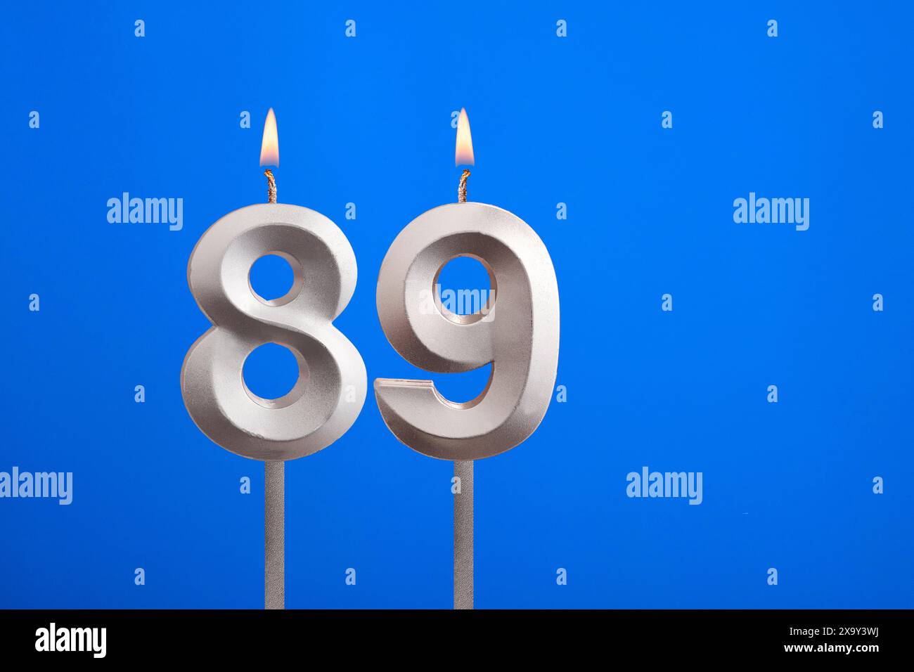 Birthday candle number 89 - Celebration card on blue background Stock ...
