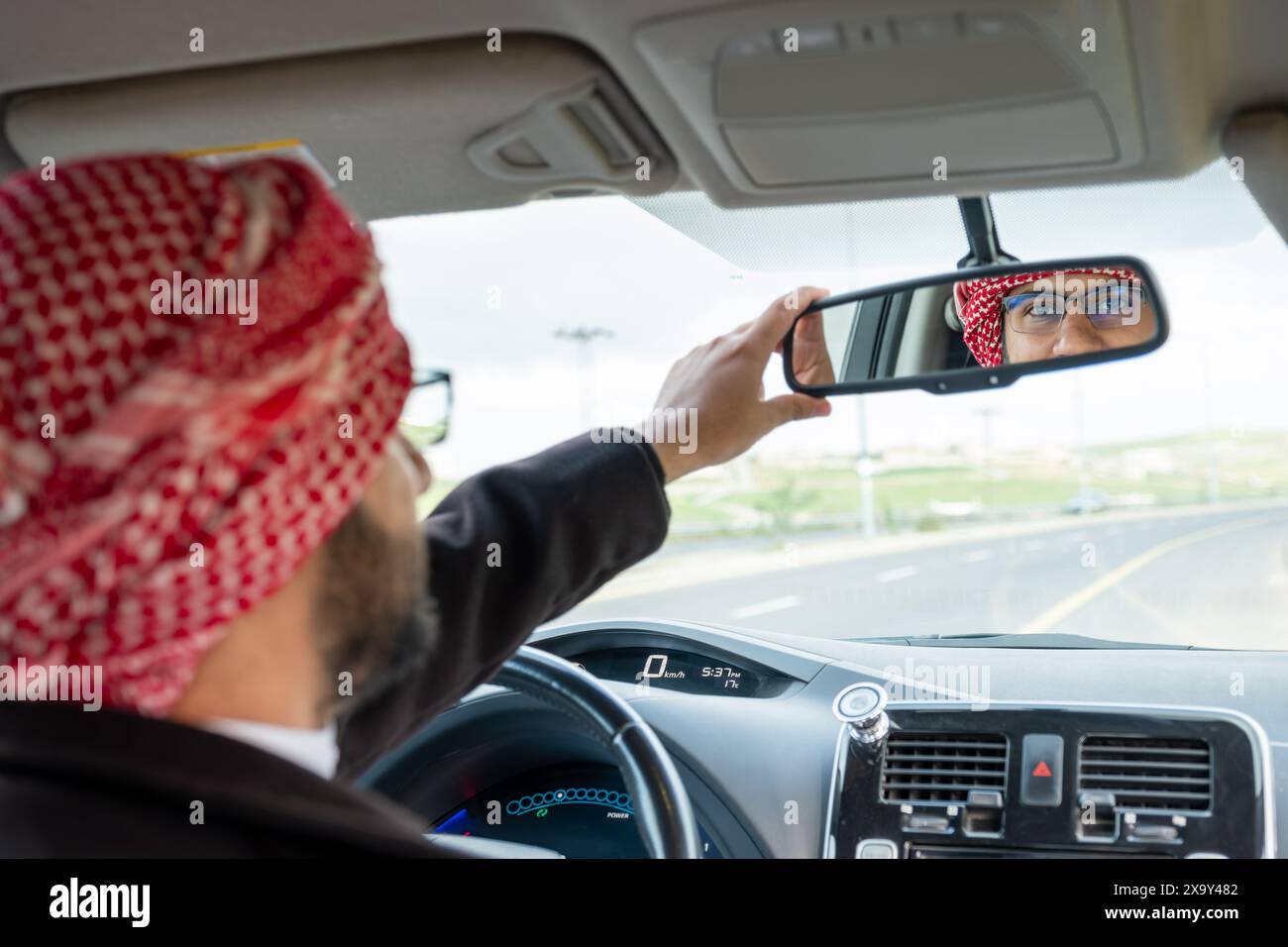 Cheerful arabic driver in his car Stock Photo - Alamy