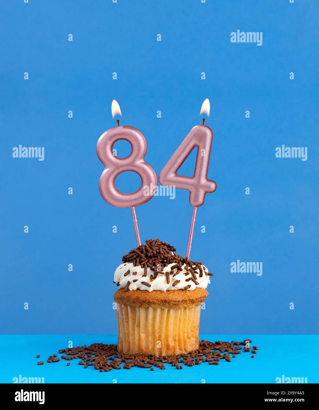 Candle number 84 - Birthday card with cupcake on blue background Stock ...