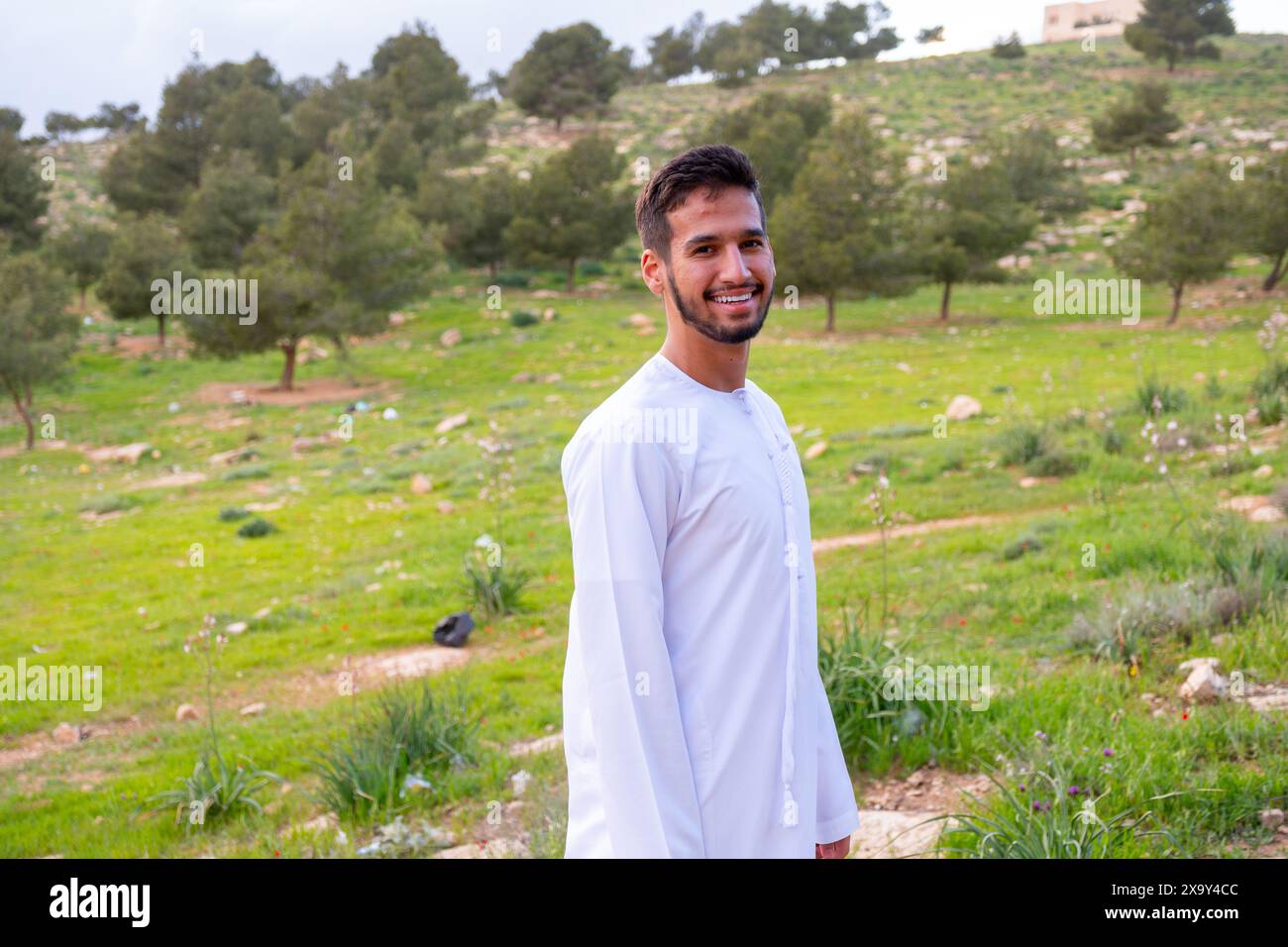Arabic male enjoy spring time outdoors having clear mind and rest in ...