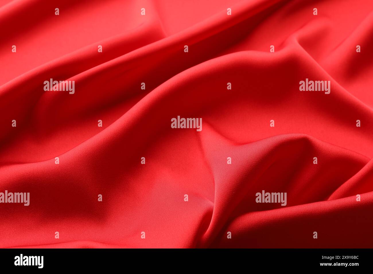Crumpled red silk fabric as background, closeup Stock Photo - Alamy
