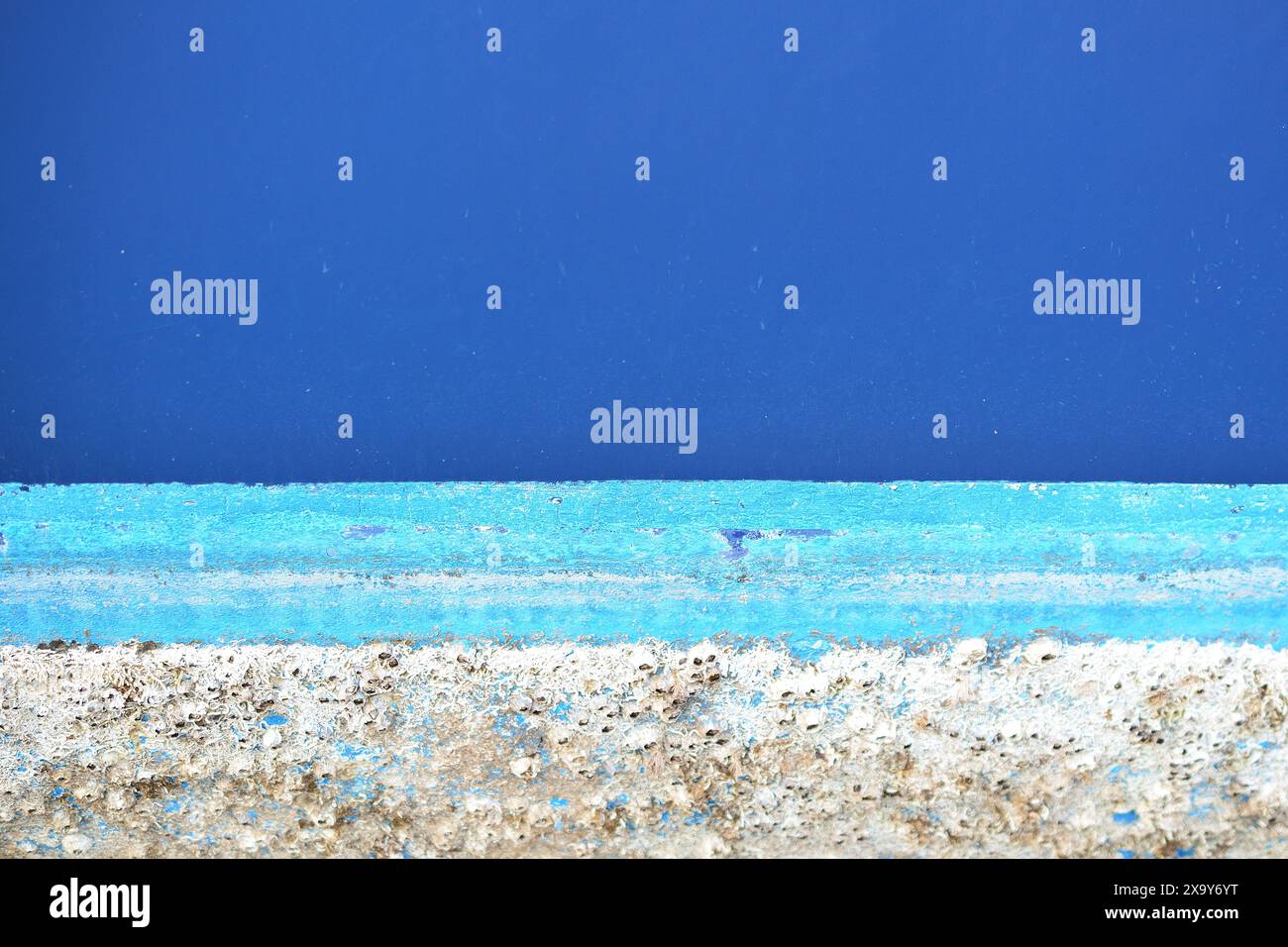 Natural sand colour texture of barnacle growth under the waterline on ...