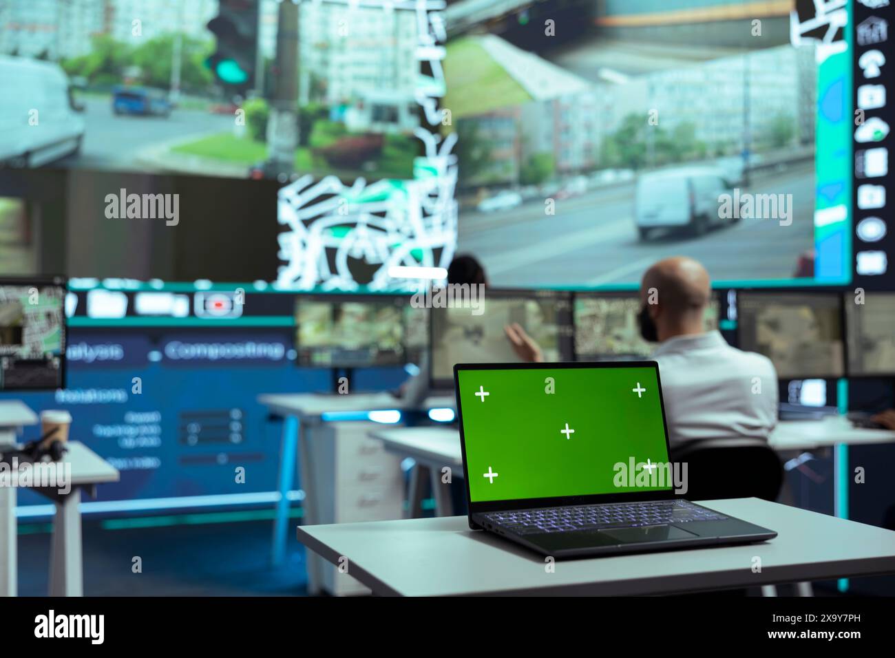 Diverse employees monitoring delivery trucks routes with an isolated ...