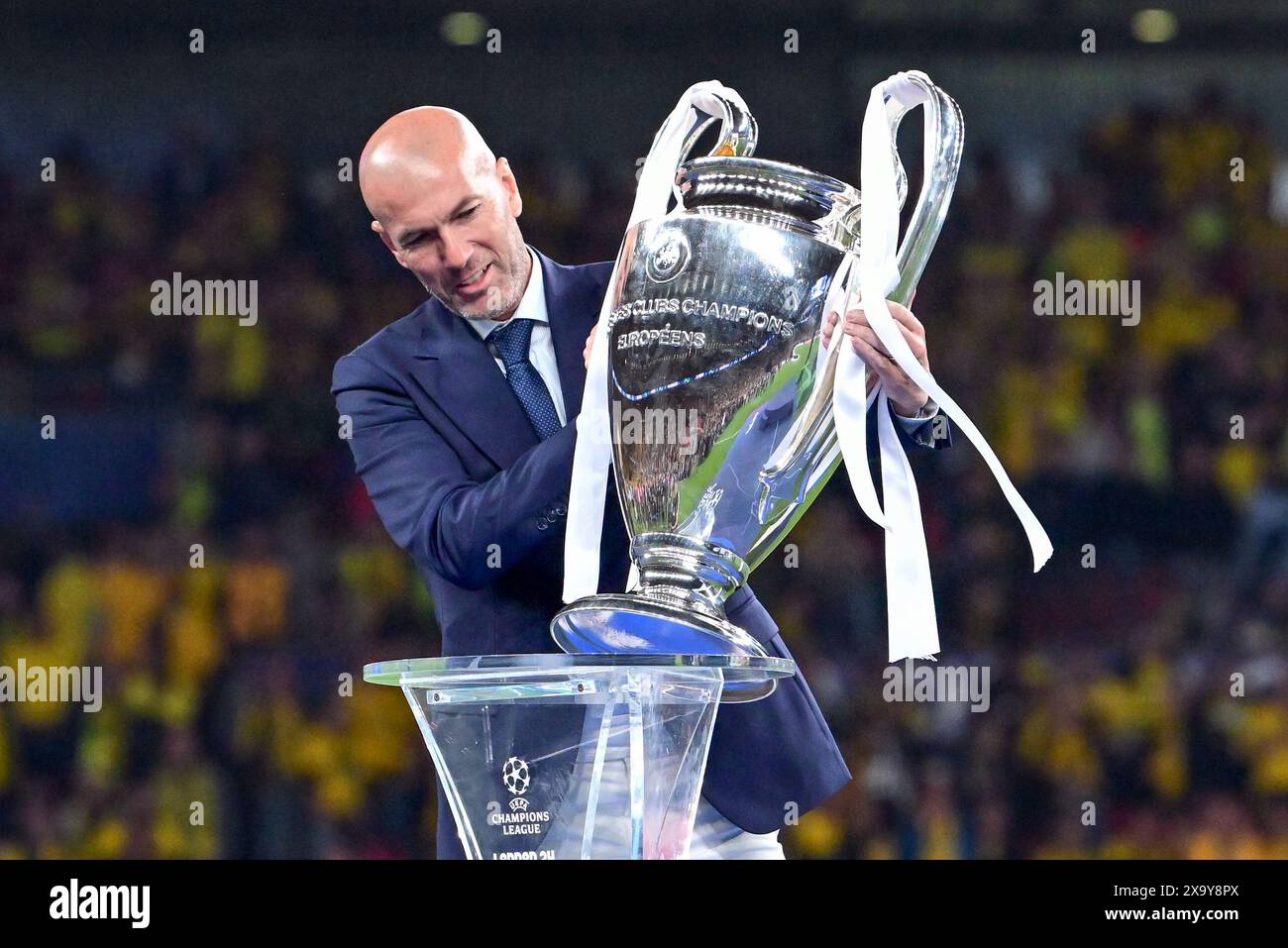 London, England. 01st, June 2024. Zinedine Zidane carries the trophy to ...