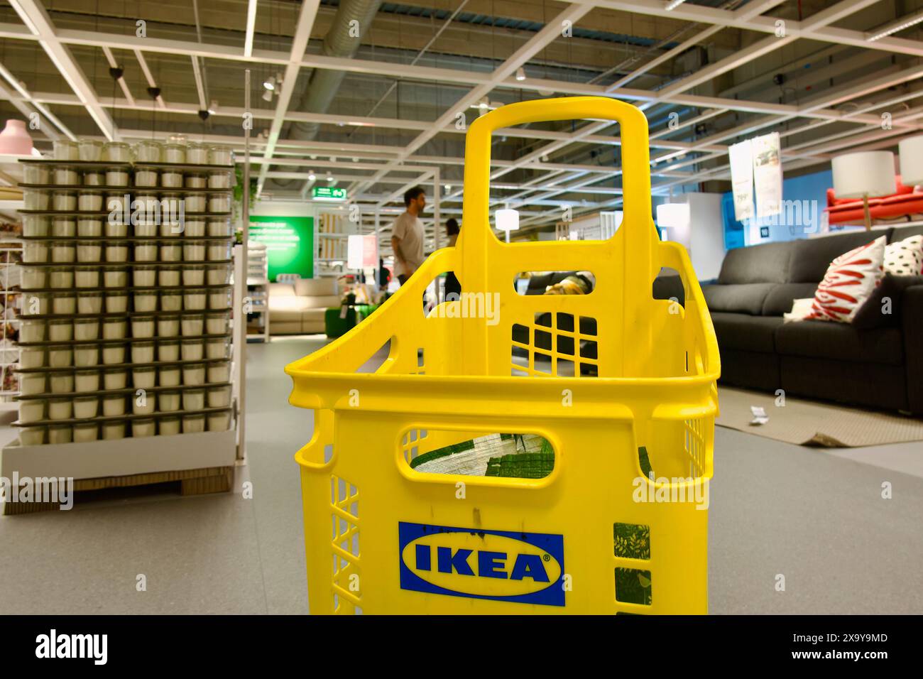 interior of the IKEA store with a shopping trolley in the foreground in ...
