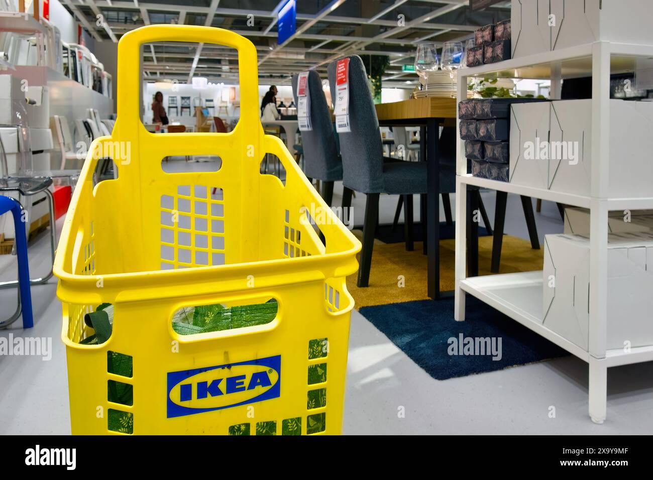 interior of the IKEA store with a shopping trolley in the foreground in ...