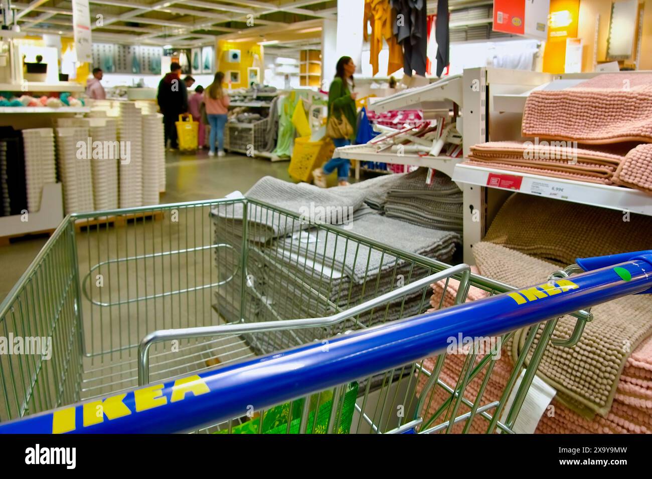 interior of the IKEA store with a shopping trolley in the foreground in ...