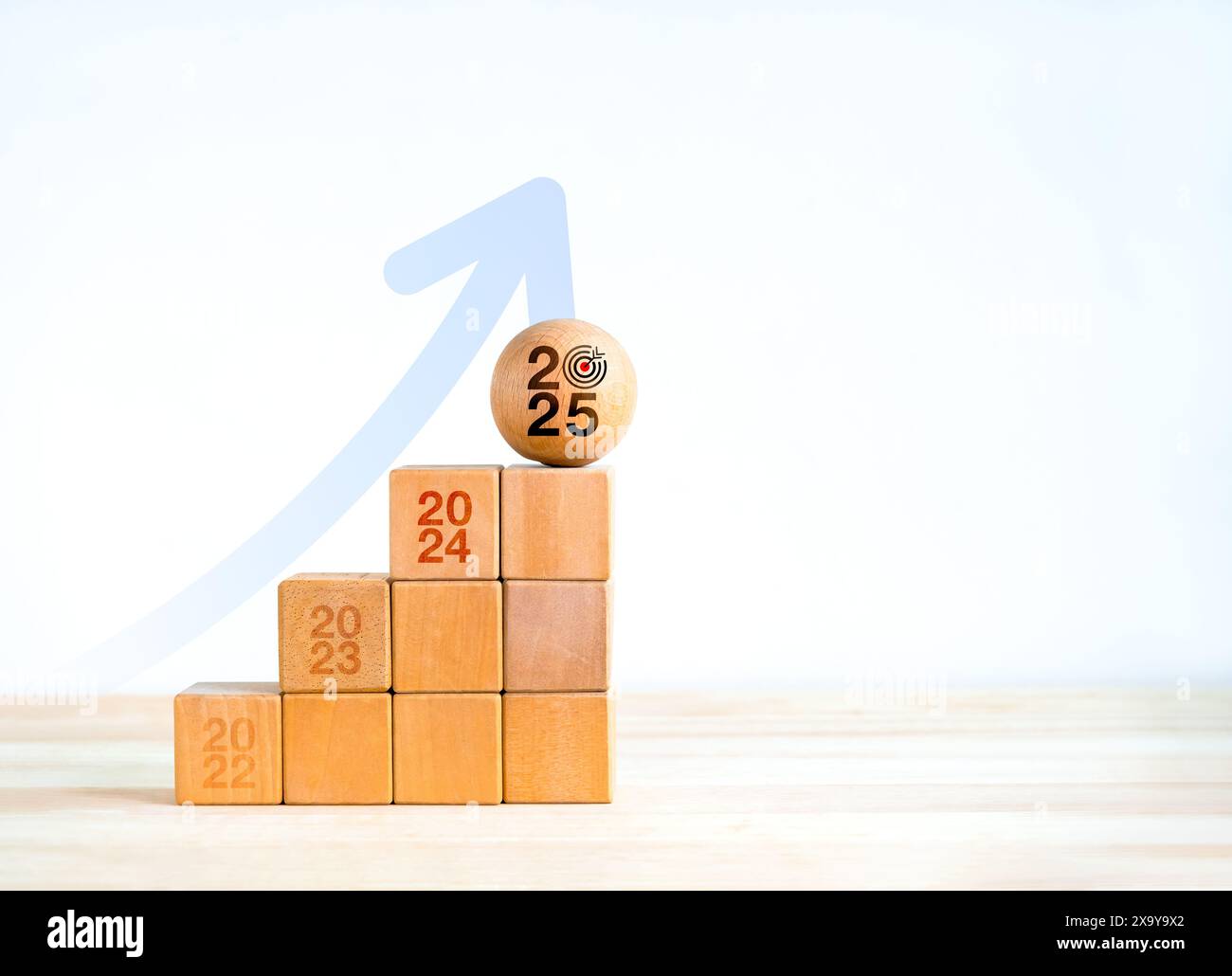 2025 year number with target icon on wood sphere on eco cube blocks as ...
