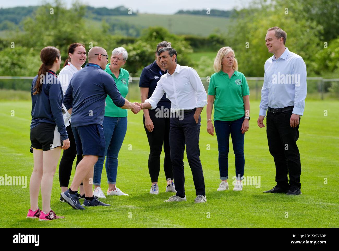 Prime Minister Rishi Sunak (third right) meets members of staff and ...