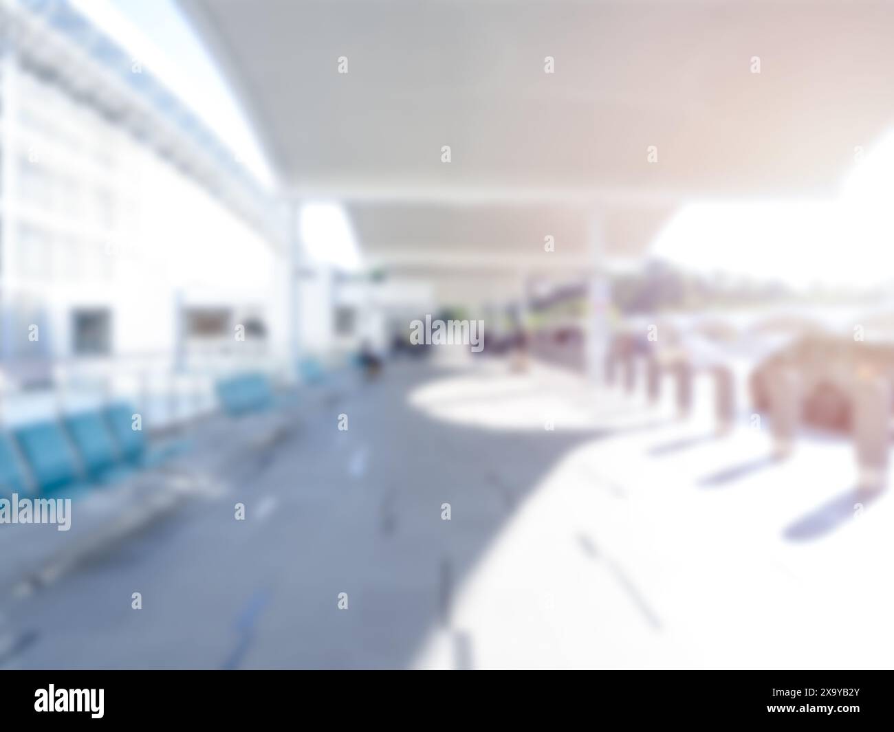 Blurred empty walkway courtyard at modern interior terminal building ...