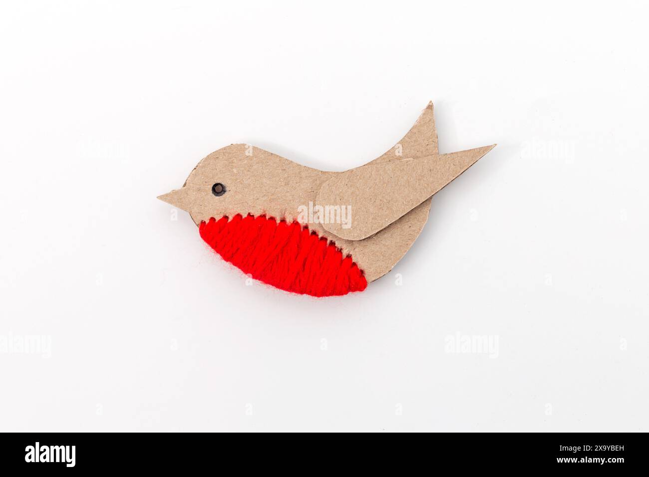 Simple craft representation of a bird made from cut-out pieces of ...