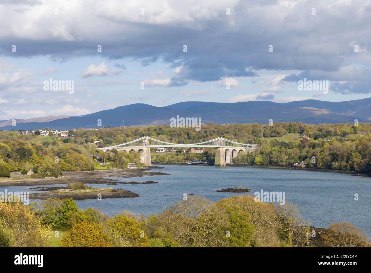 Menai Suspension Bridge and hills of Snowdonia from Anglesey Stock ...