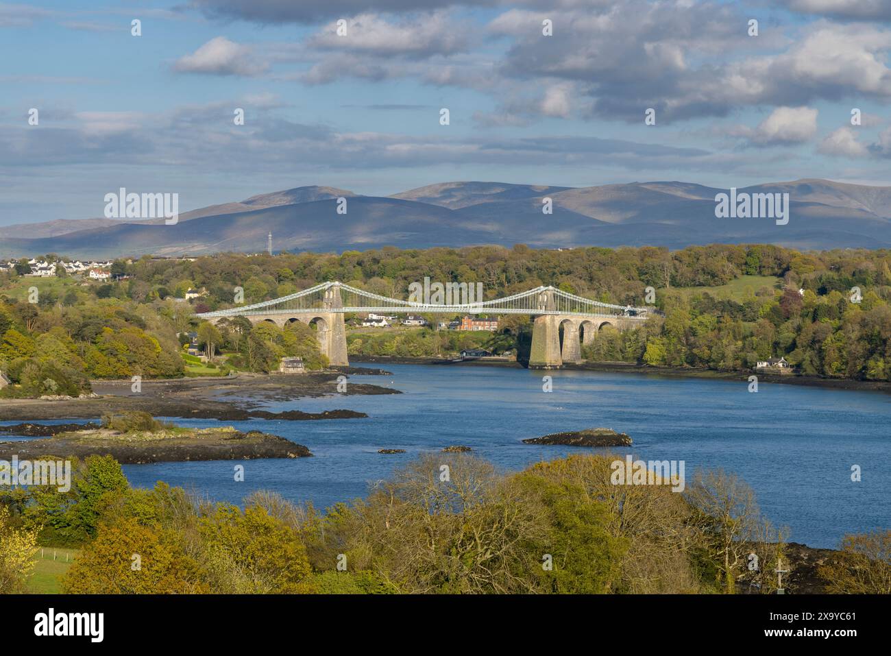 Menai Suspension Bridge and hills of Snowdonia from Anglesey Stock ...