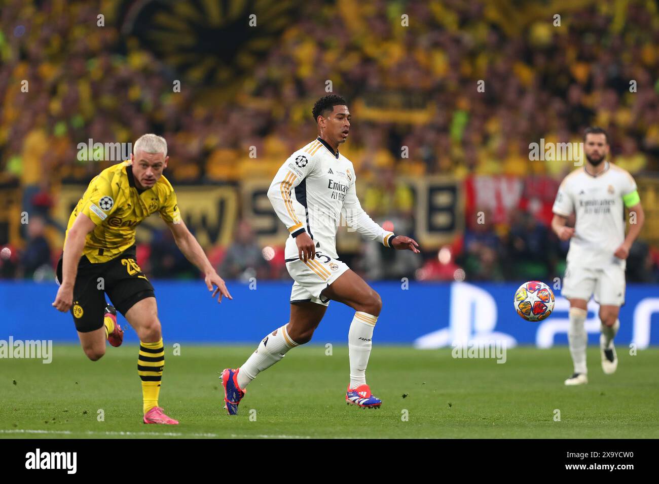 Jude Bellingham of Real Madrid and Julian Ryerson of Borussia Dortmund ...