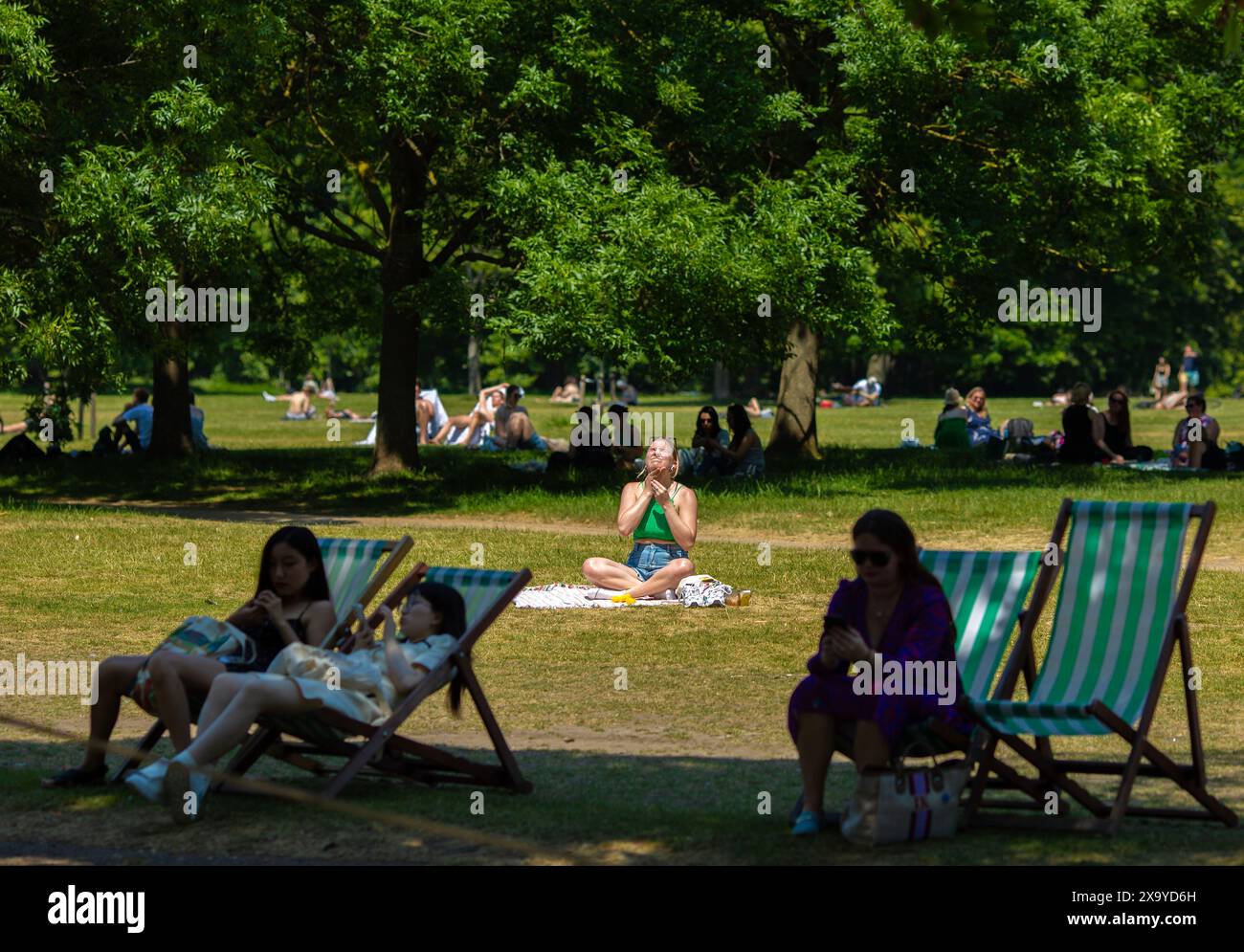 People enjoy a spell of hot weather as some sunbathe and others avoid ...