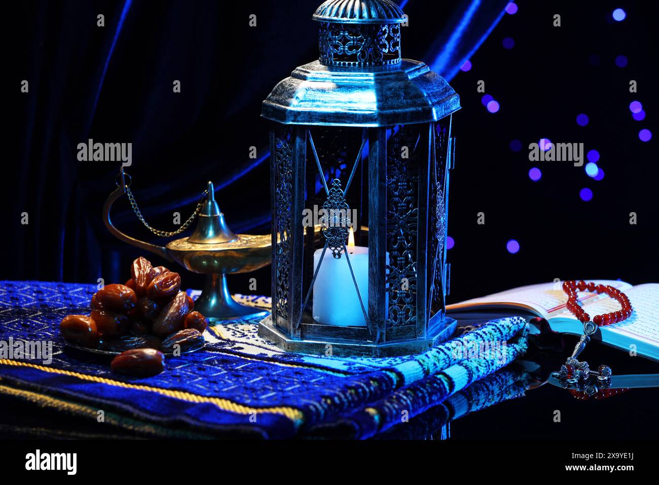 Arabic lantern, Quran, misbaha, Aladdin magic lamp, dates and folded ...