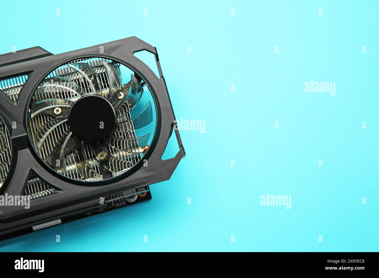 One graphics card on light blue background, top view. Space for text ...