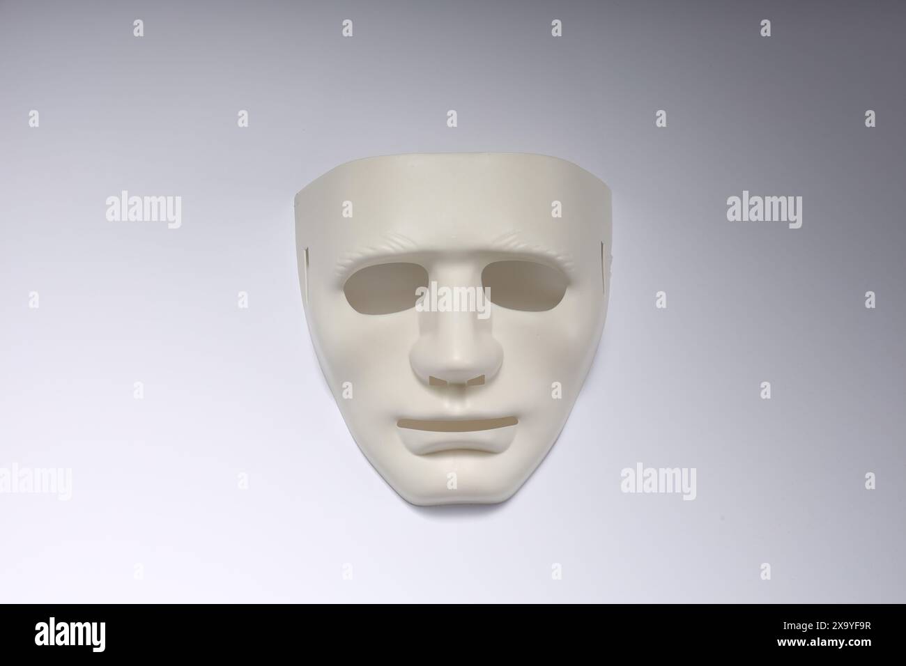 Theater arts. Plastic mask on white background, top view Stock Photo ...